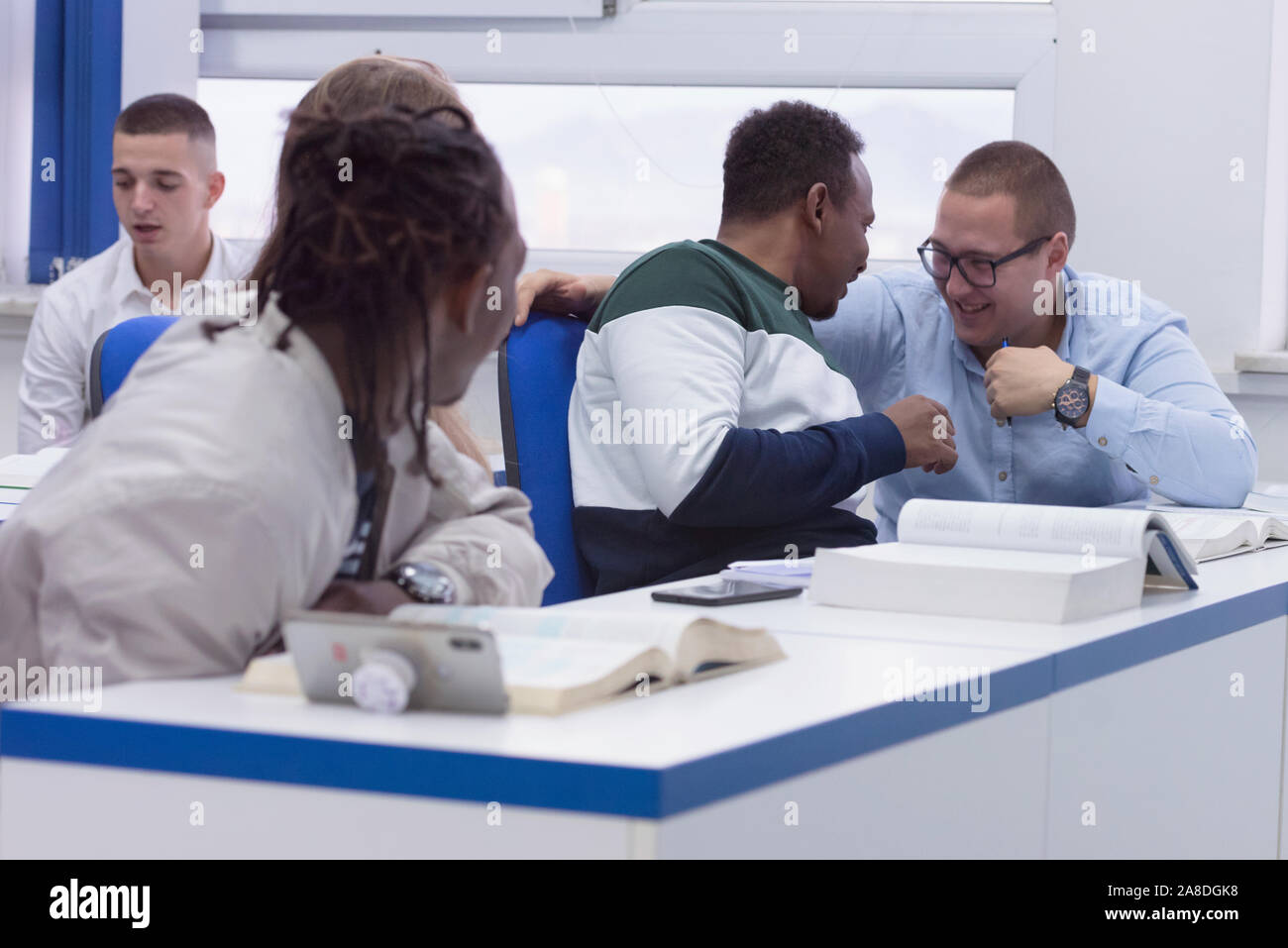 University Students during the class. Resolving problems together. Team ...