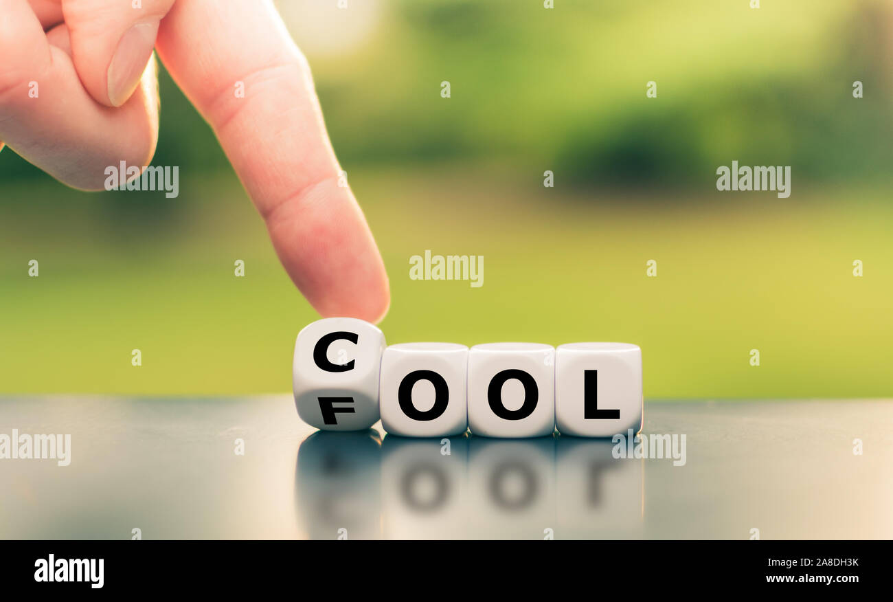 Be cool or a fool? Hand turns a dice and changes the word "fool" to ...