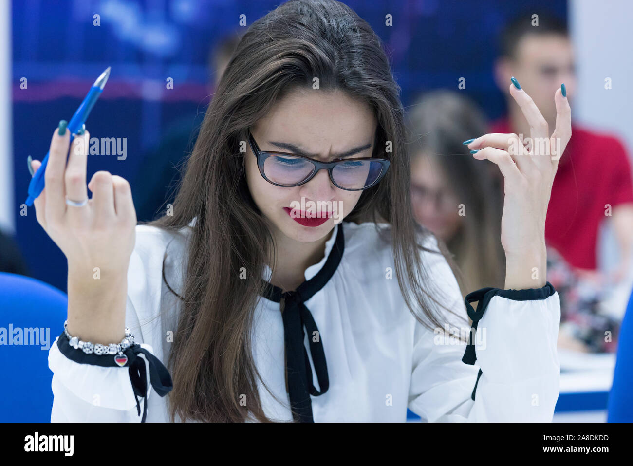 Young female student in math class overwhelmed by the math formula ...