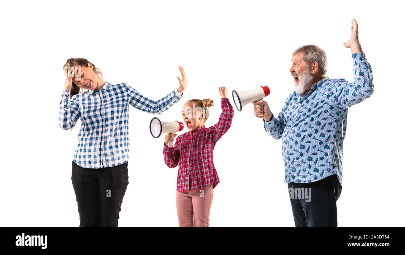 Family members arguing with one another on white studio background ...