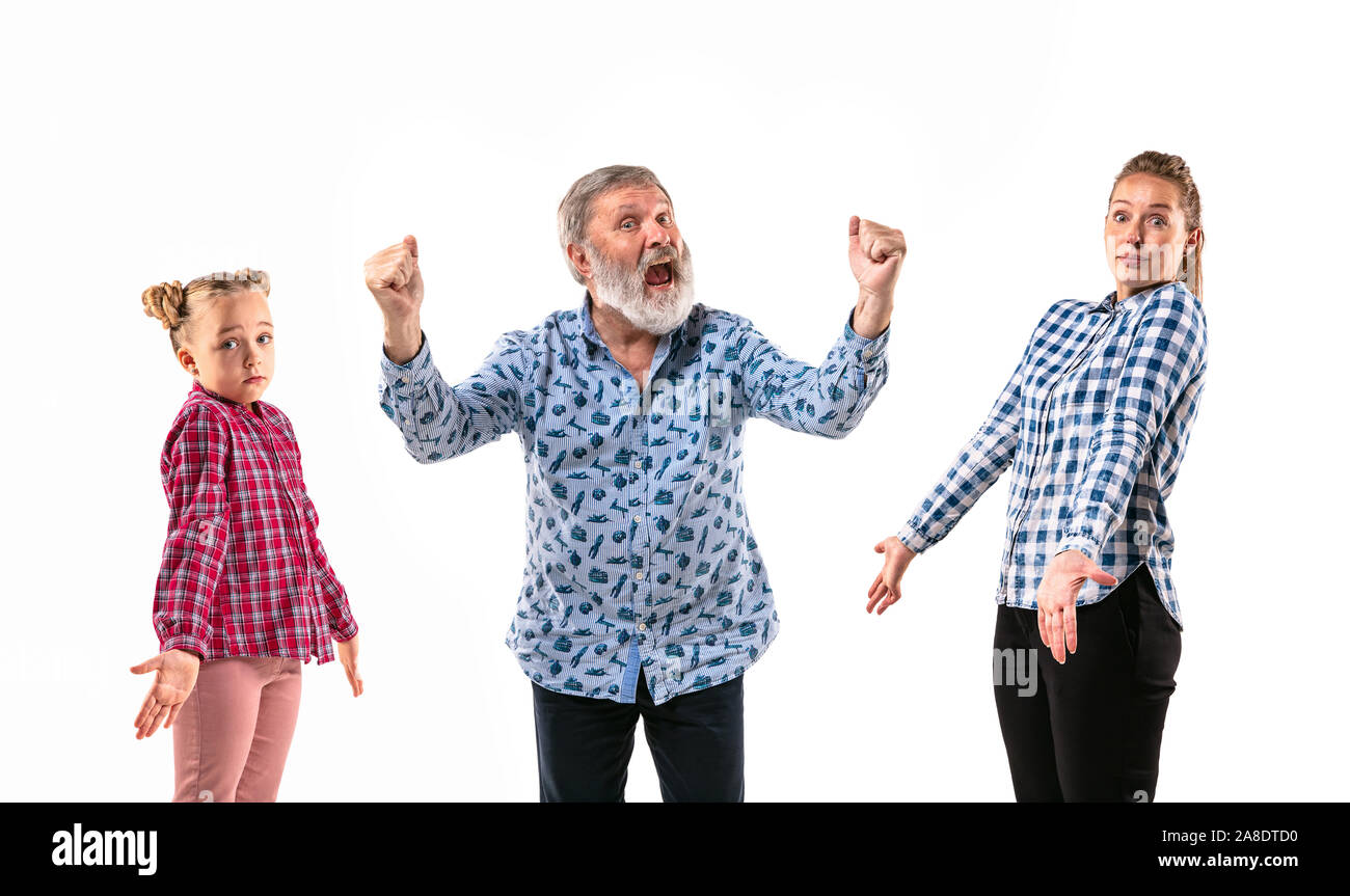 Family members arguing with one another on white studio background ...