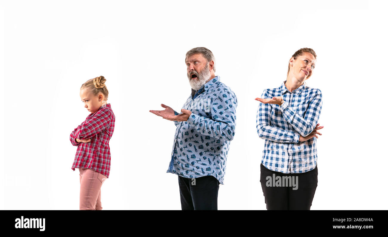 Family members arguing with one another on white studio background ...