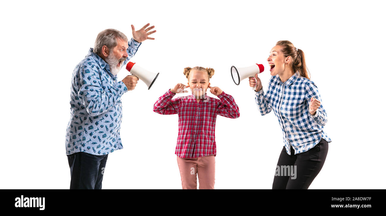 Family members arguing with one another on white studio background ...