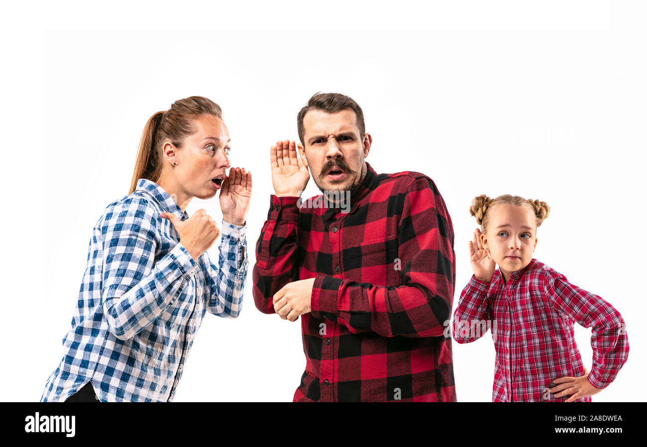 Family members arguing with one another on white studio background ...