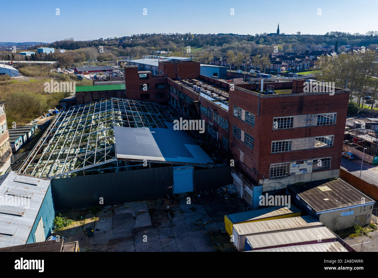 Aerial, overhead views of an abandoned factory, left to decline in the ...
