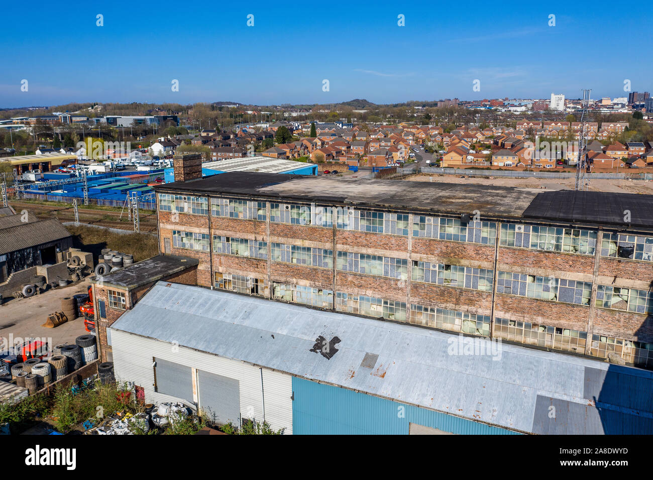 Aerial, overhead views of an abandoned factory, left to decline in the ...