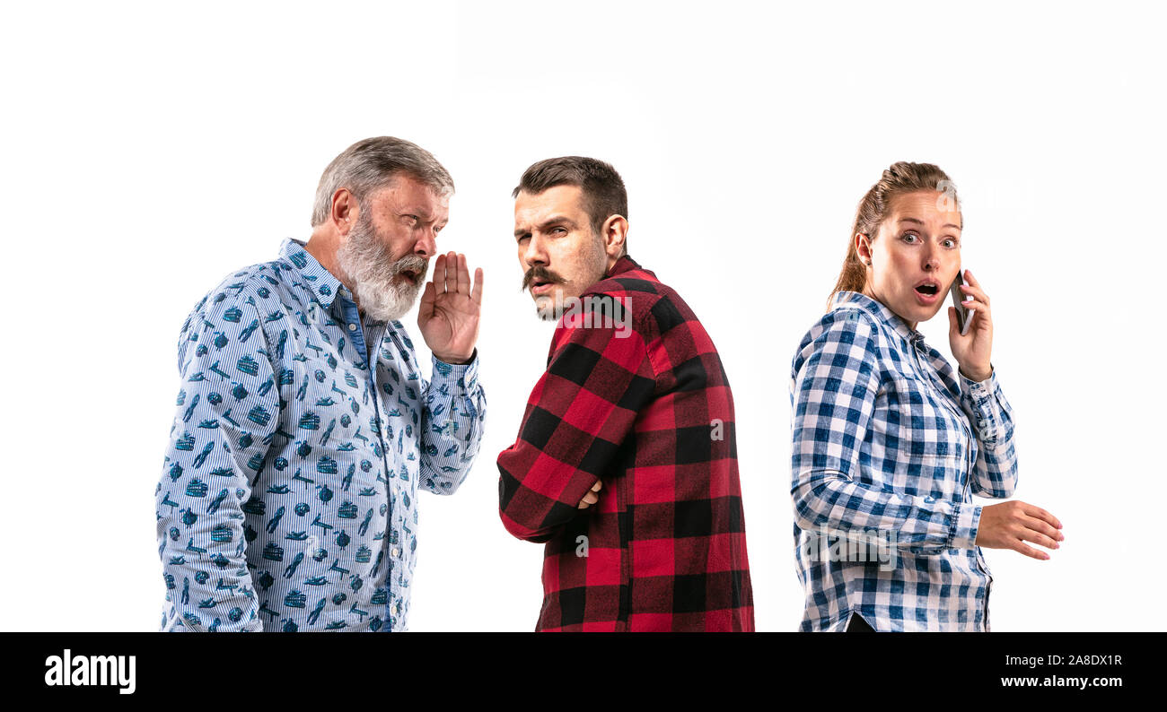 Family members arguing with one another on white studio background ...