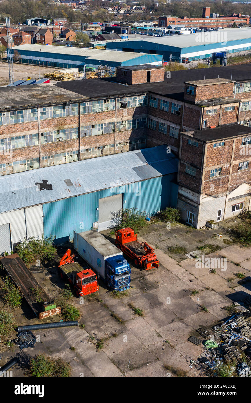 Aerial, overhead views of an abandoned factory, left to decline in the ...
