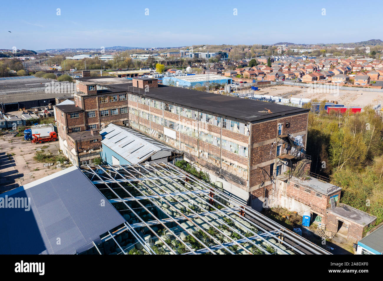 Aerial, overhead views of an abandoned factory, left to decline in the ...
