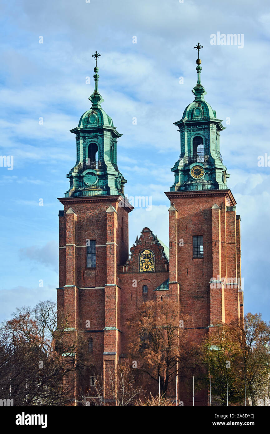 The towers of the gothic basilica archdiocese of Gniezno Stock Photo ...