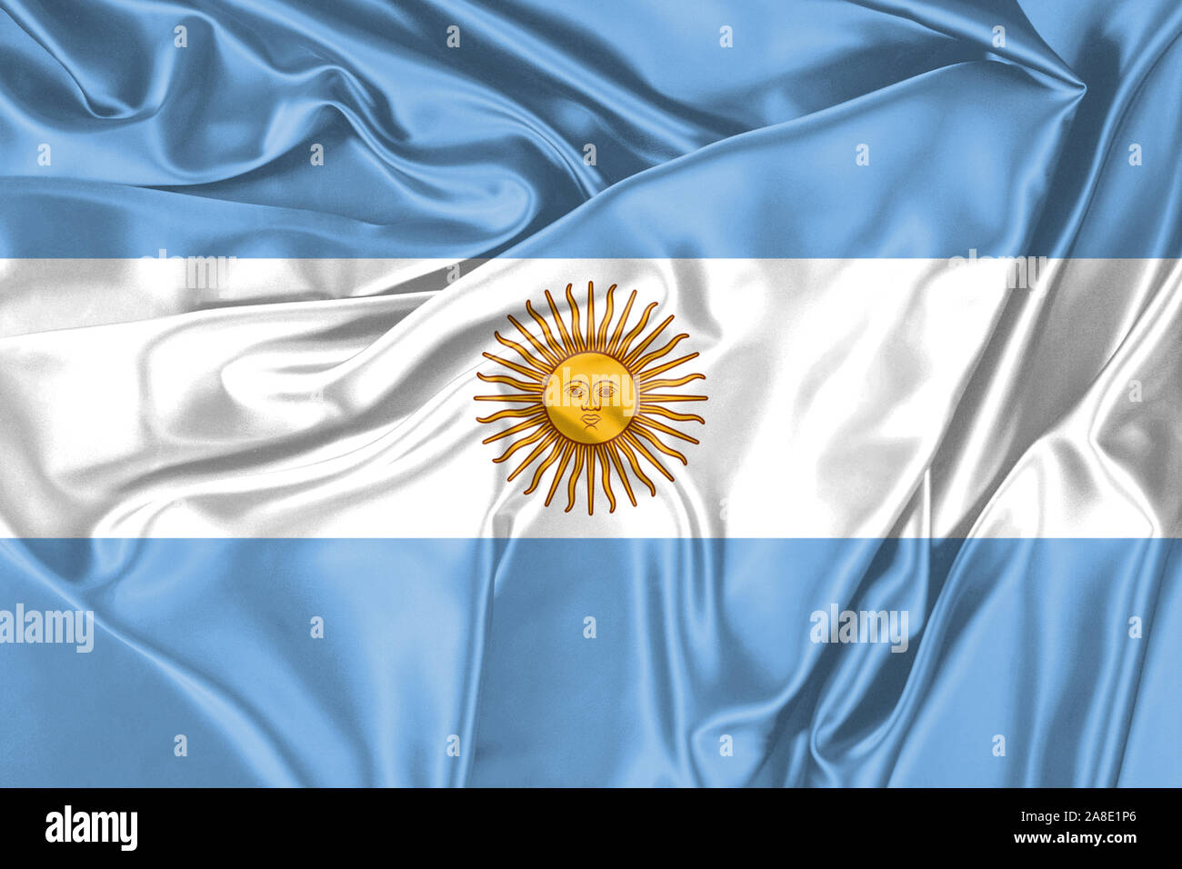 Shiny crippled Argentina flag is laying on a surface. Realistic ...
