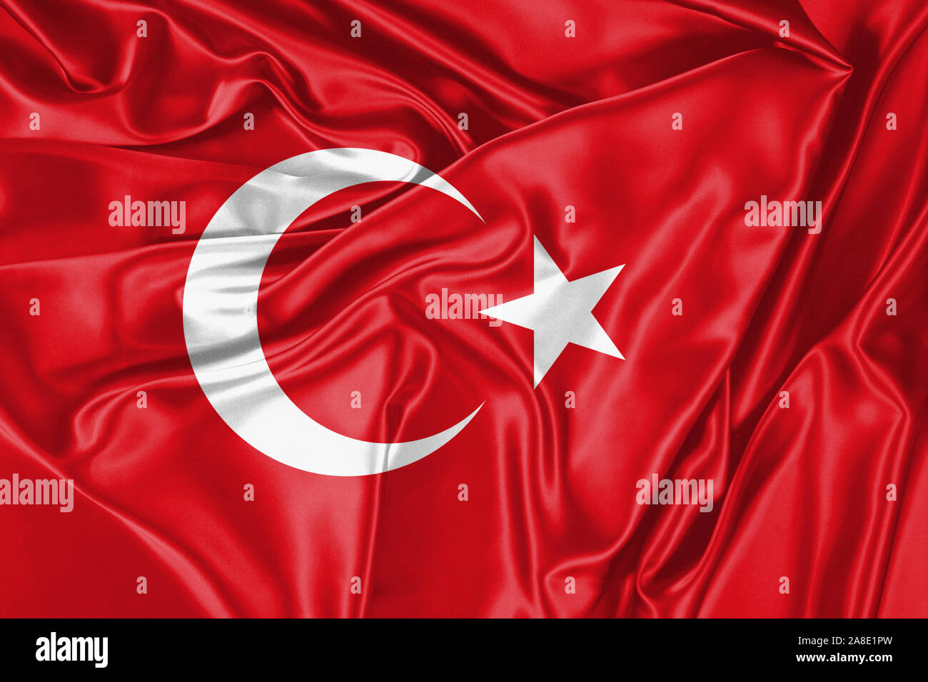Shiny crippled Turkish flag is laying on a surface. Realistic ...
