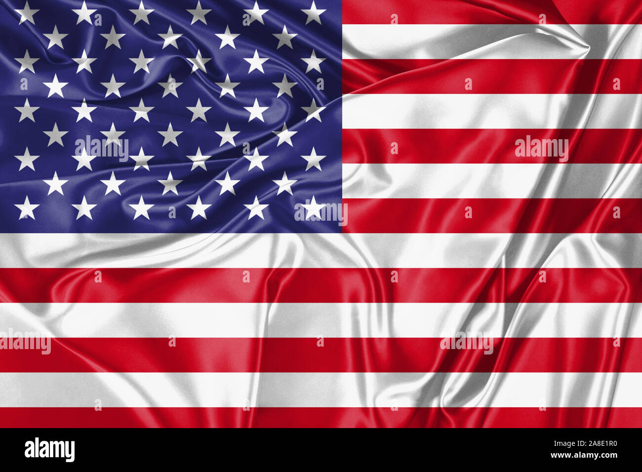 Shiny crippled USA flag is laying on a surface. Realistic reflections ...