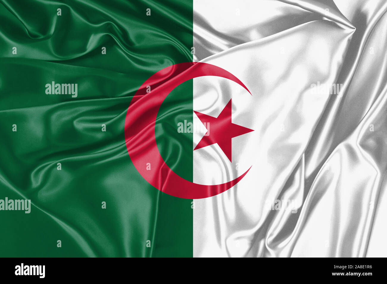 Shiny crippled Algeria flag is laying on a surface. Realistic ...