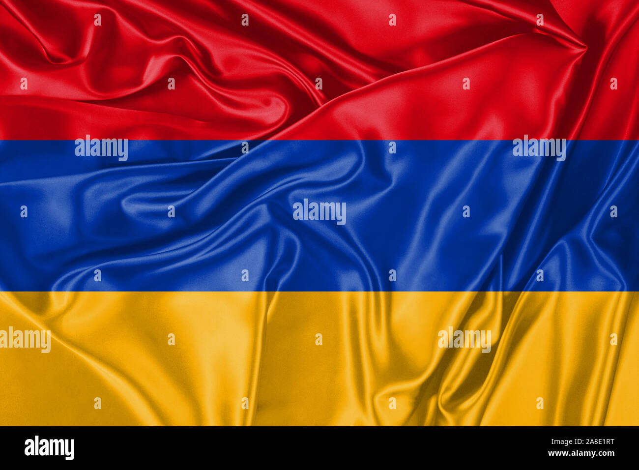 Shiny crippled Armenian flag is laying on a surface. Realistic ...