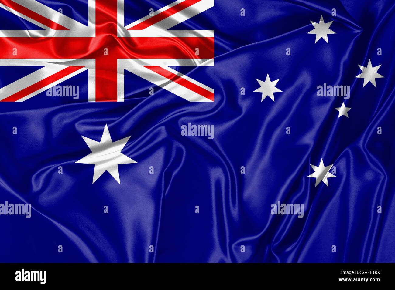 Shiny crippled Australian flag is laying on a surface. Realistic ...