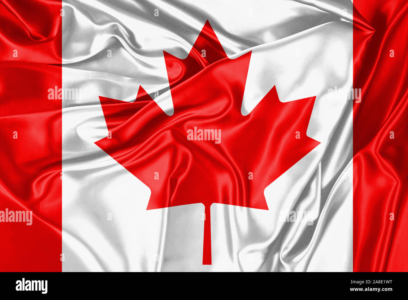 Shiny crippled Canadian flag is laying on a surface. Realistic ...