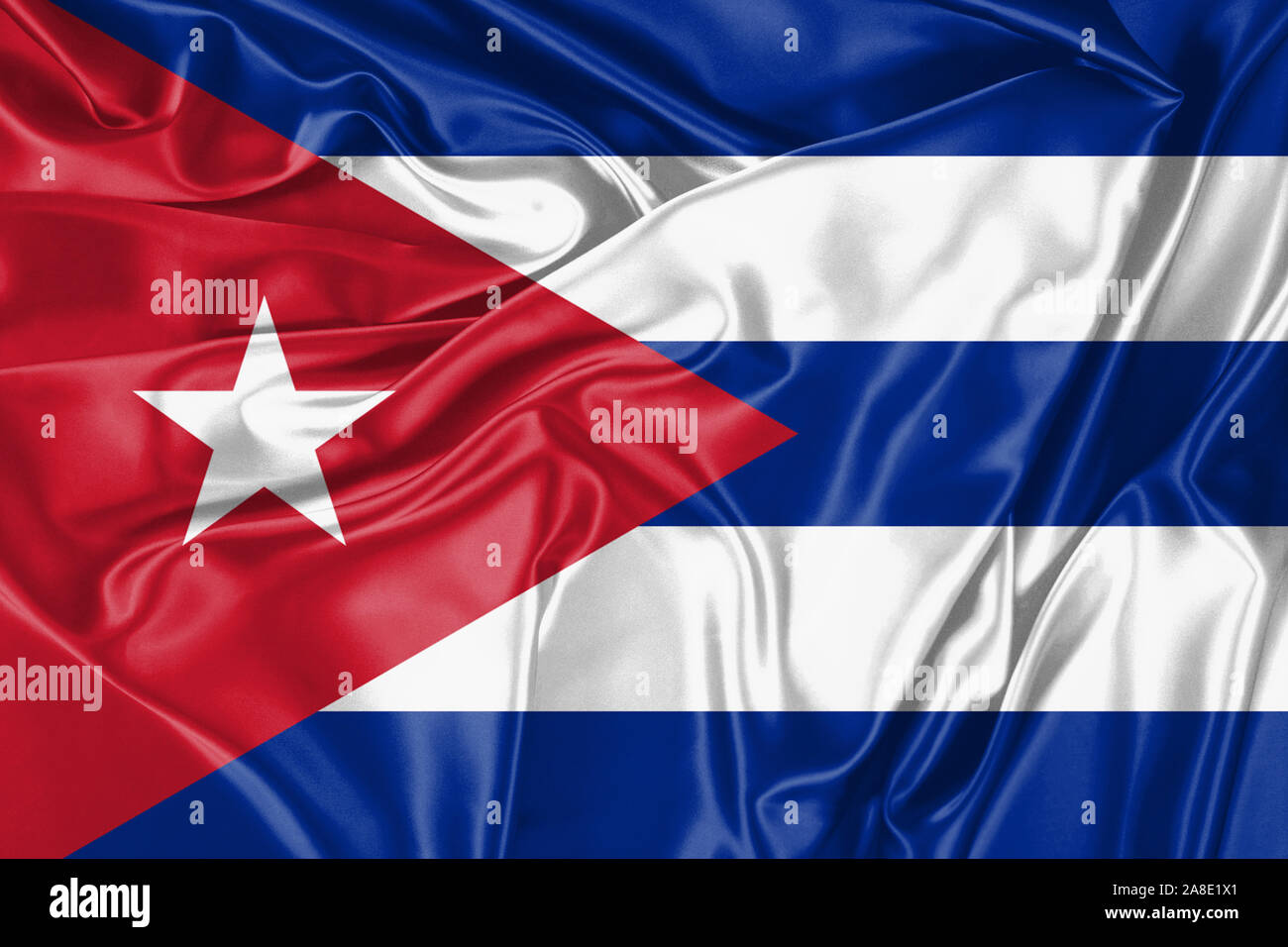 Shiny crippled Cuban flag is laying on a surface. Realistic reflections ...