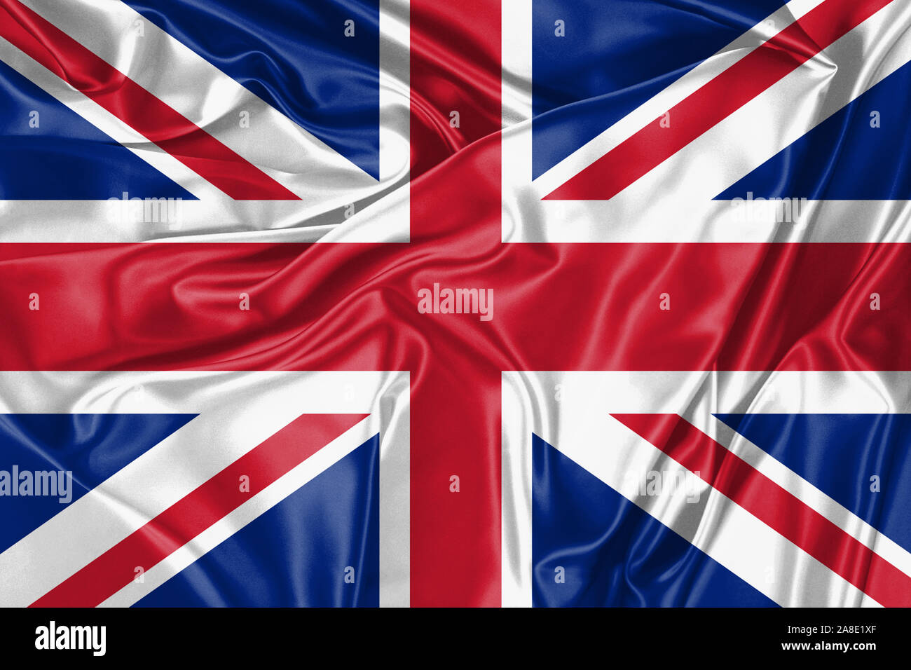 Shiny crippled Great Britain flag is laying on a surface. Realistic ...