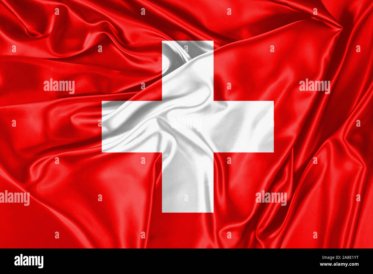 Shiny crippled Swiss flag is laying on a surface. Realistic reflections ...