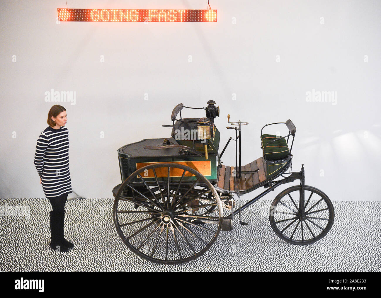 Assistant Curator Esme Hawes looks at an 1888 Patent-Motorwagen No.3 ...