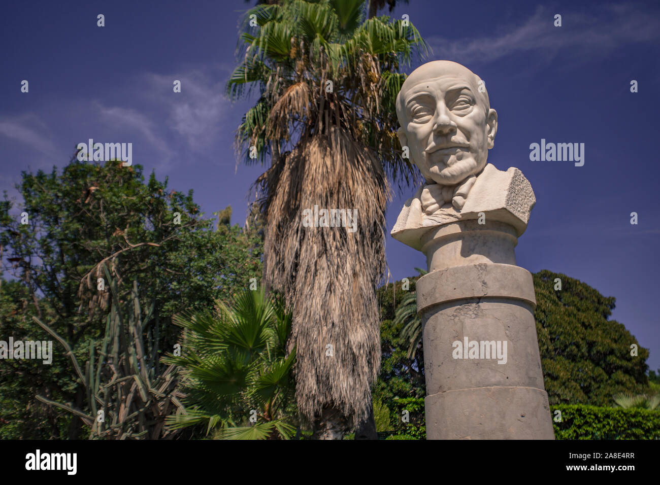 Park with statue in Palermo Stock Photo - Alamy