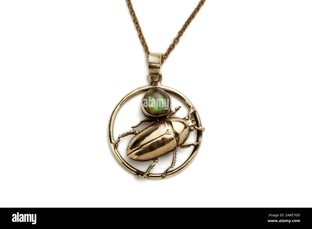 Brass June beetle and labradorite necklace pendant Stock Photo - Alamy