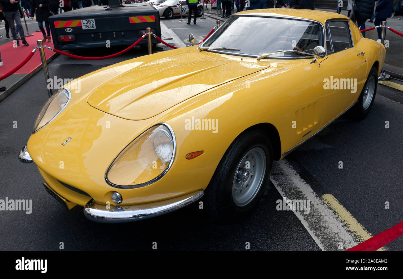 Three-quarter front view of a 1967, yellow, Ferrari 275 GTB/4, on ...