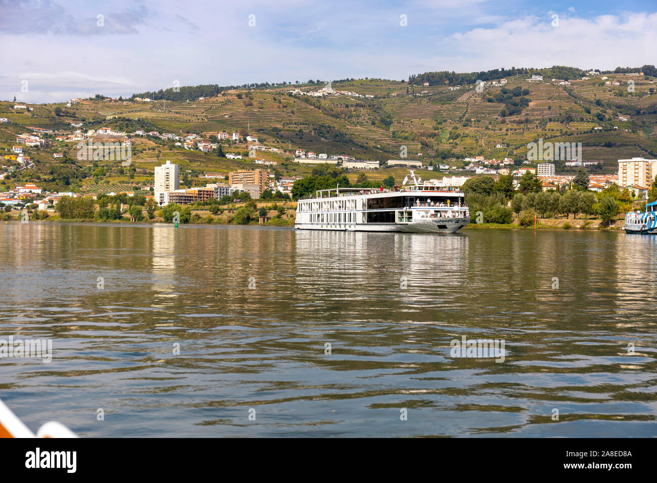 A Cruise ship passes down the Douro river at Peso da Regua Stock Photo ...