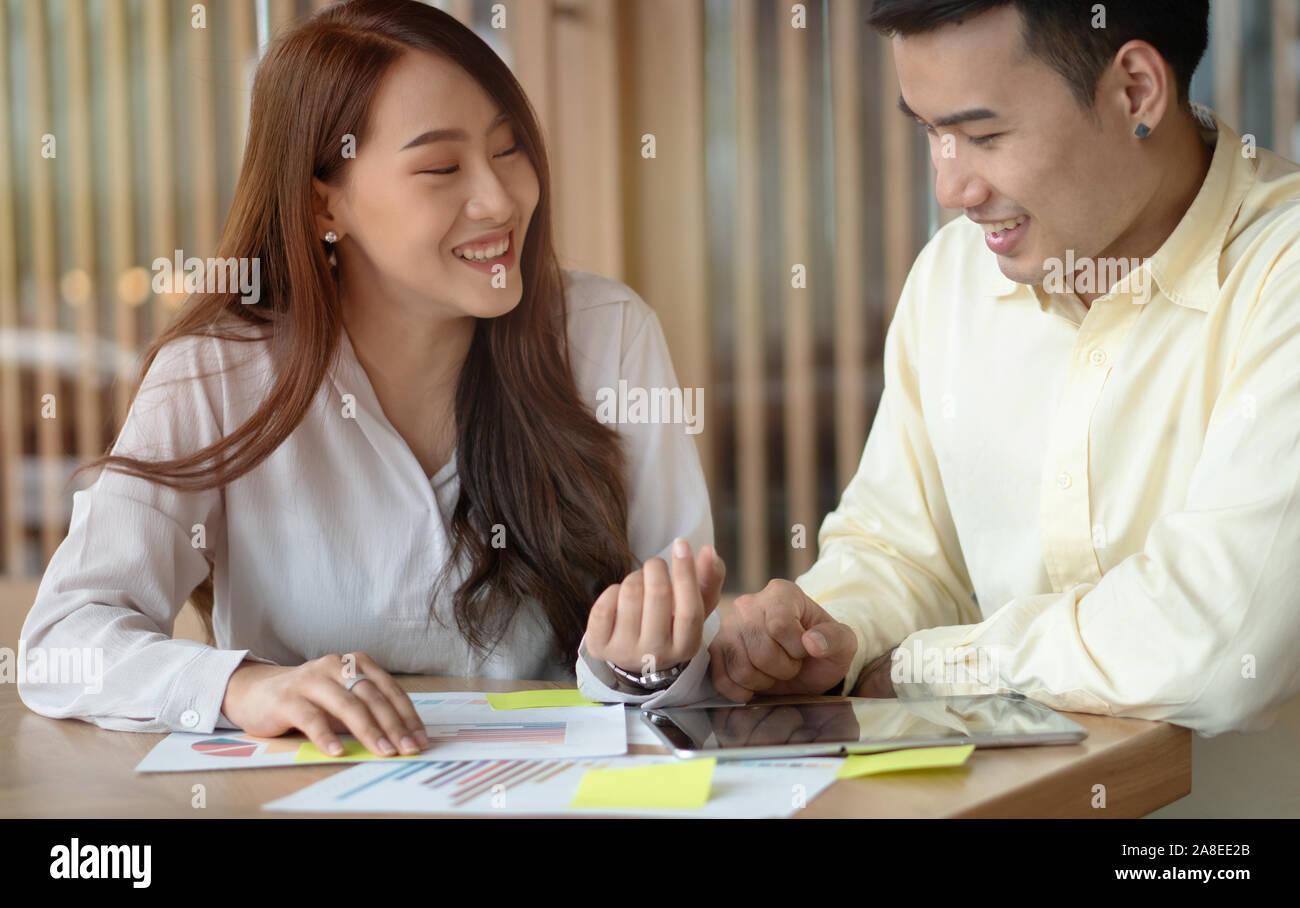 Happy Asian couples be smile after calculating income And expenses ...