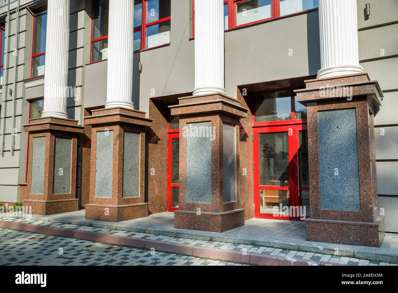 Detail of a house facade. Granite columns as decorative elements of the ...