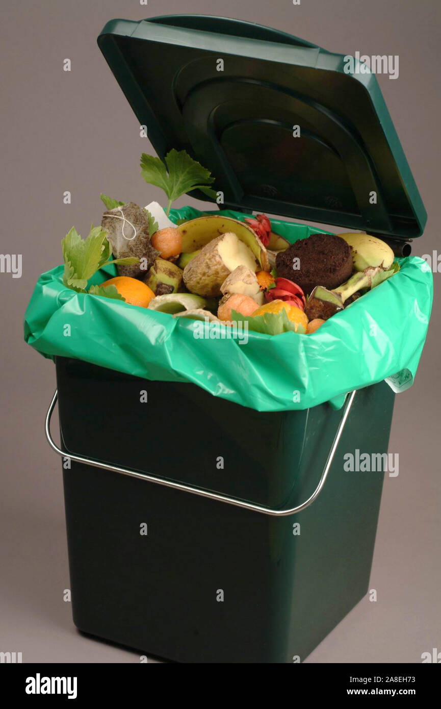Trash bin full of organic waste Stock Photo - Alamy