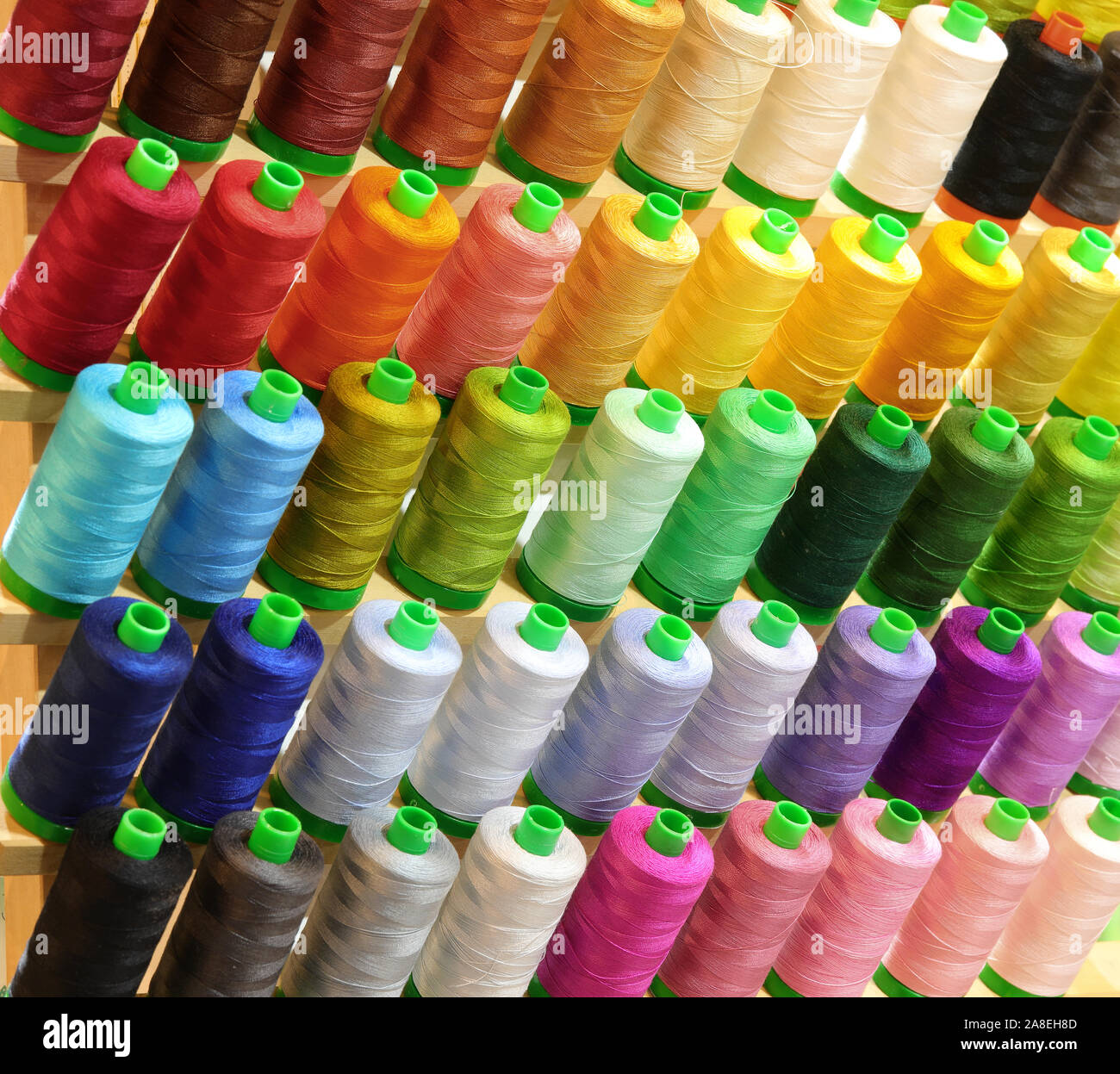 Bobbins colored thread industrial hi-res stock photography and images ...