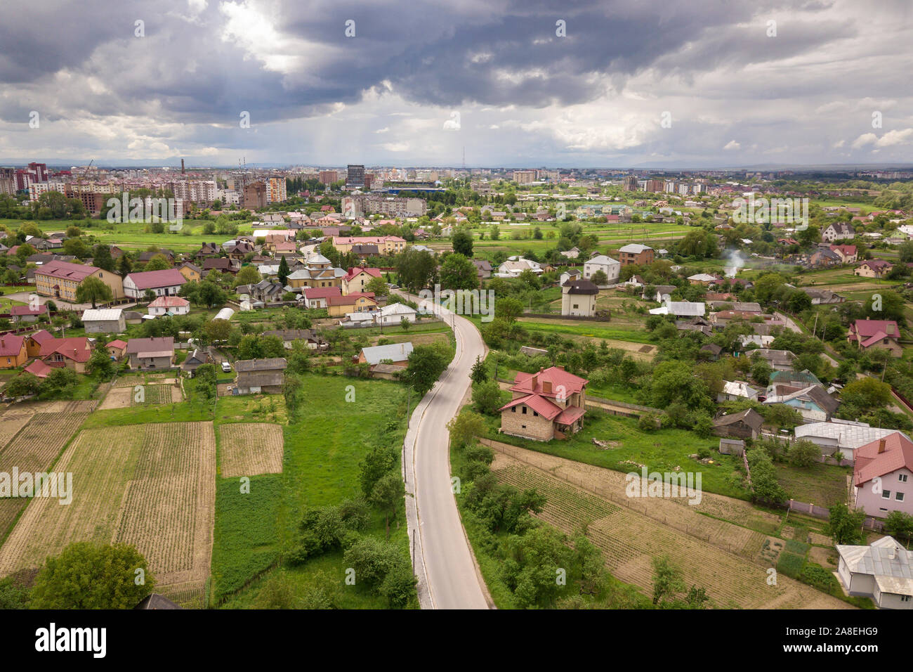 Top down aerial view of town or village with rows of buildings and ...