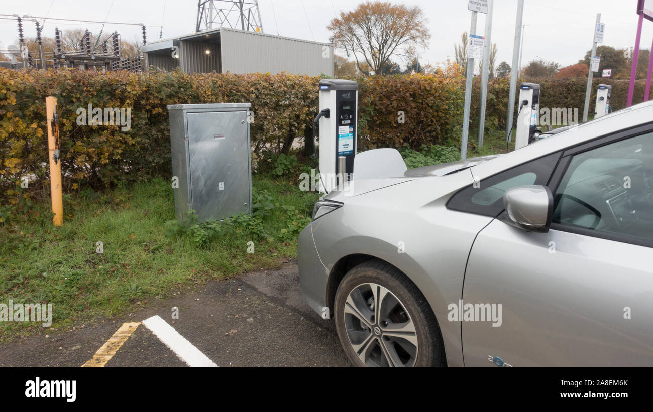 Nissan Leaf plugged into electric vehicle charging bay, NEC, Birmingham ...
