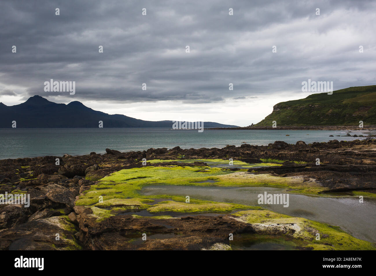 Coastal view from the Isle of Eigg looking out to the Isle of Rum Stock ...