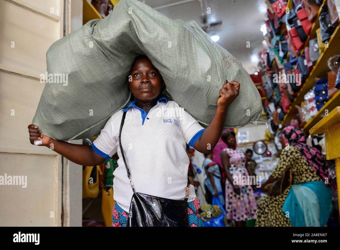 TOGO, Lome, Grande Marche, grand market, women work as porter to carry ...