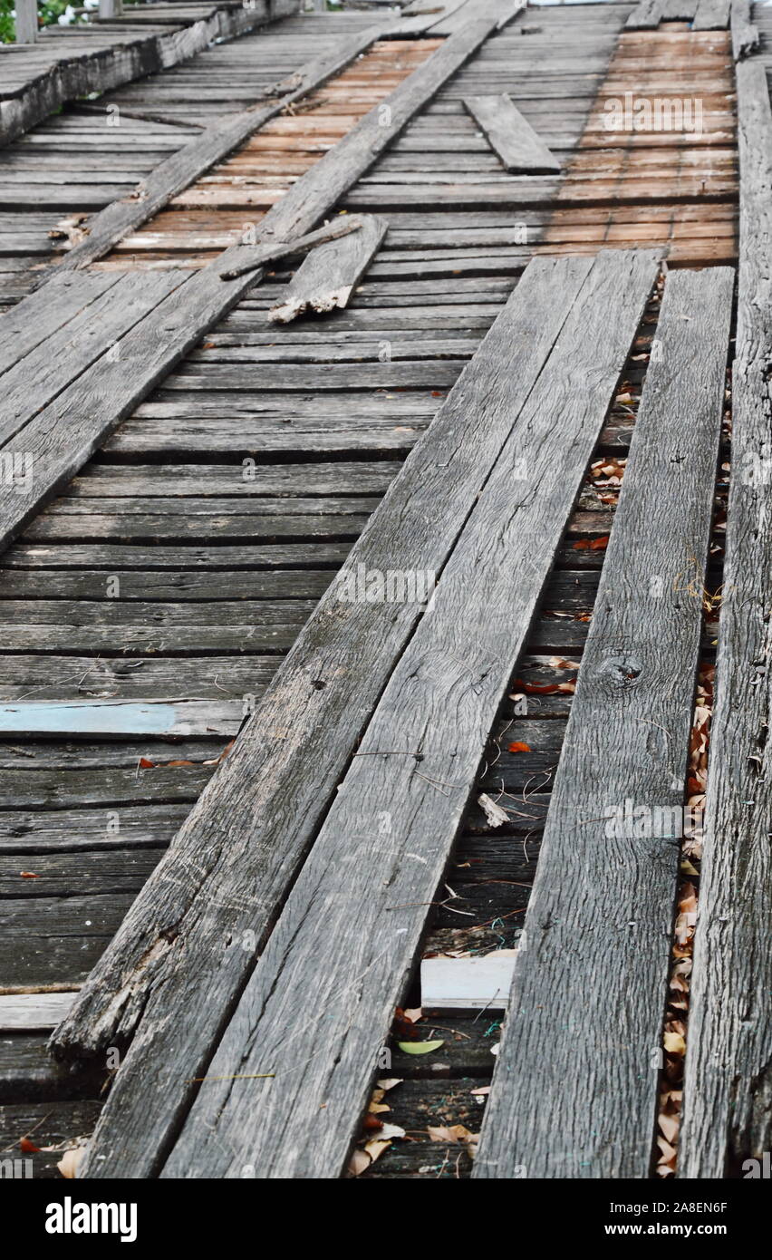 out of service old damage wooden bridge across canal Stock Photo - Alamy