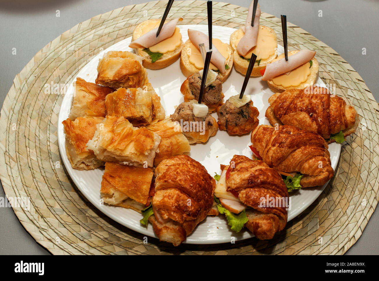 A plate of different kinds of appetizers, Party food closeup on a plate ...