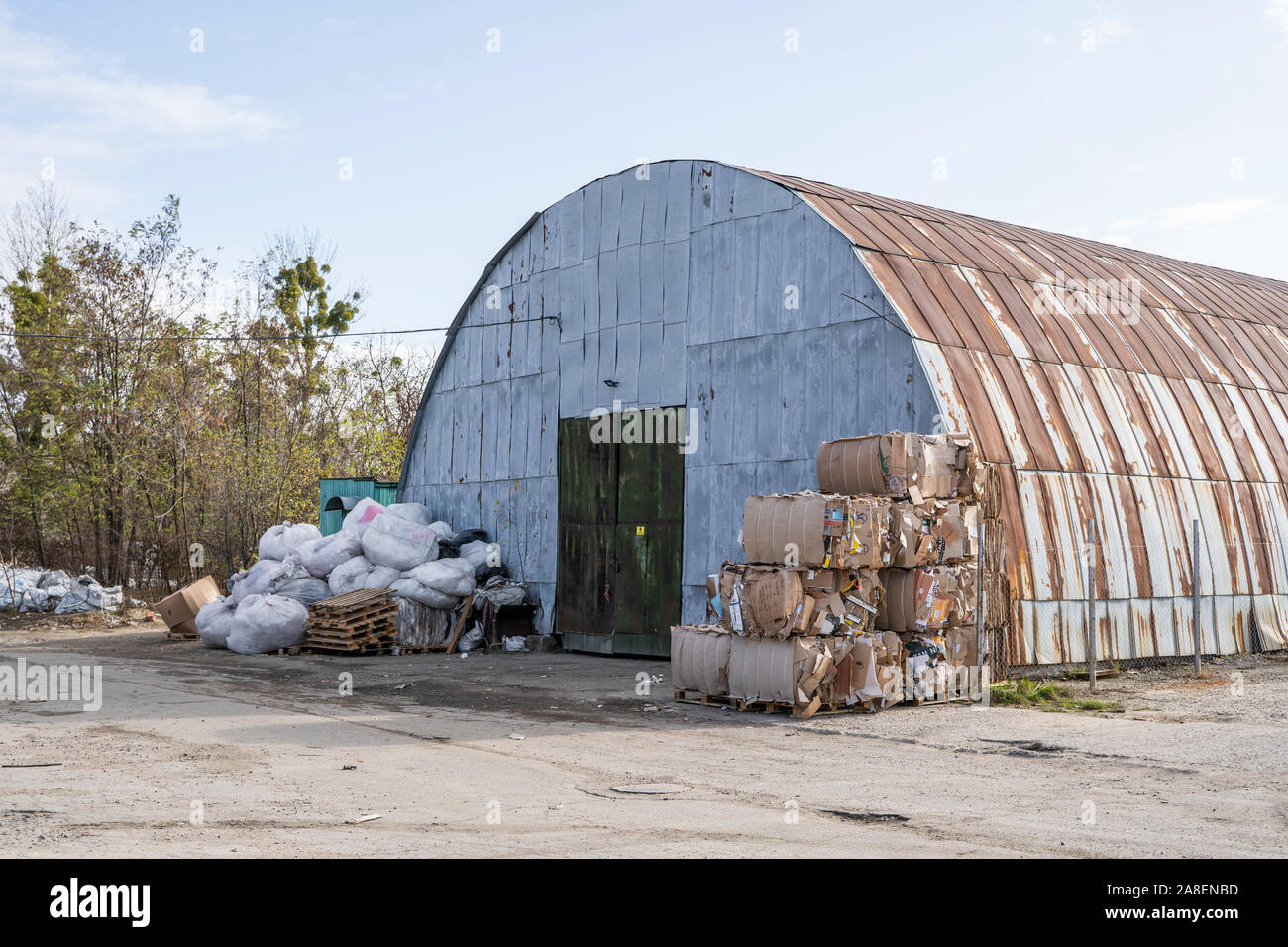 Bales of cardboard and box board with strapping wire ties. Background ...