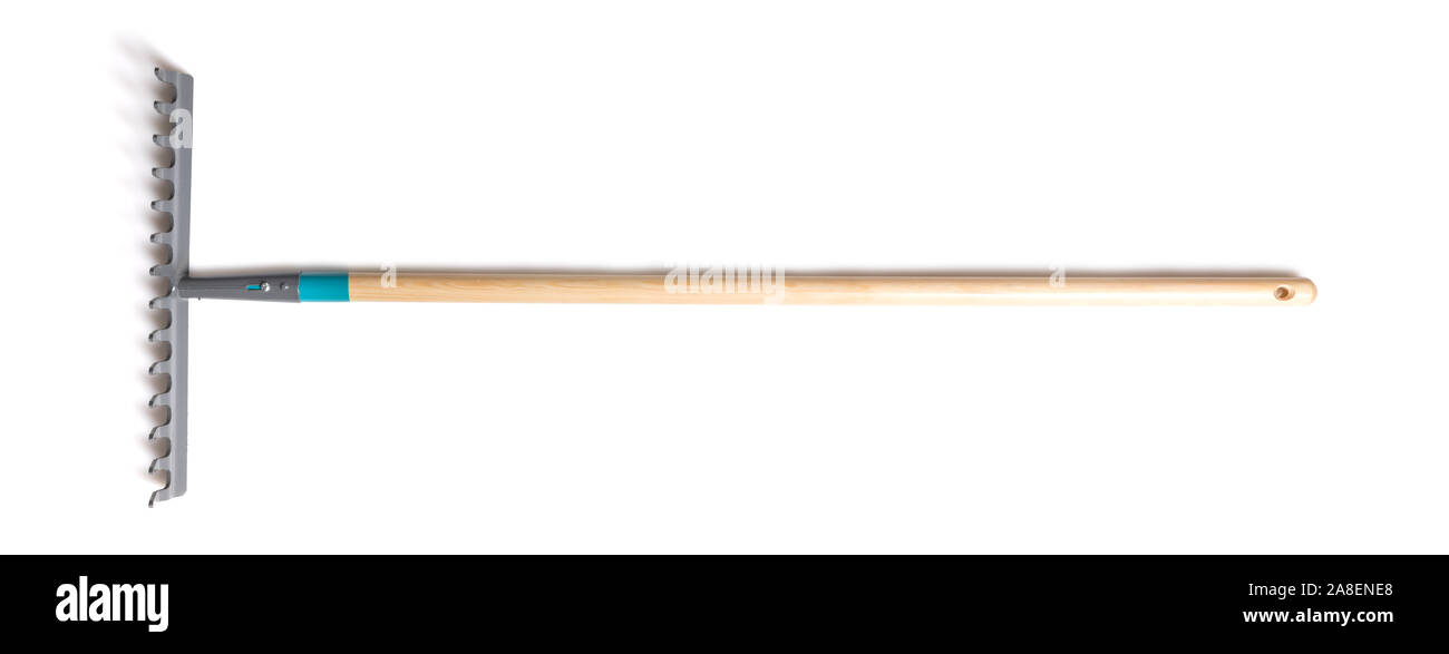 Rake with a wood handle isolated over a white background. Metal work ...
