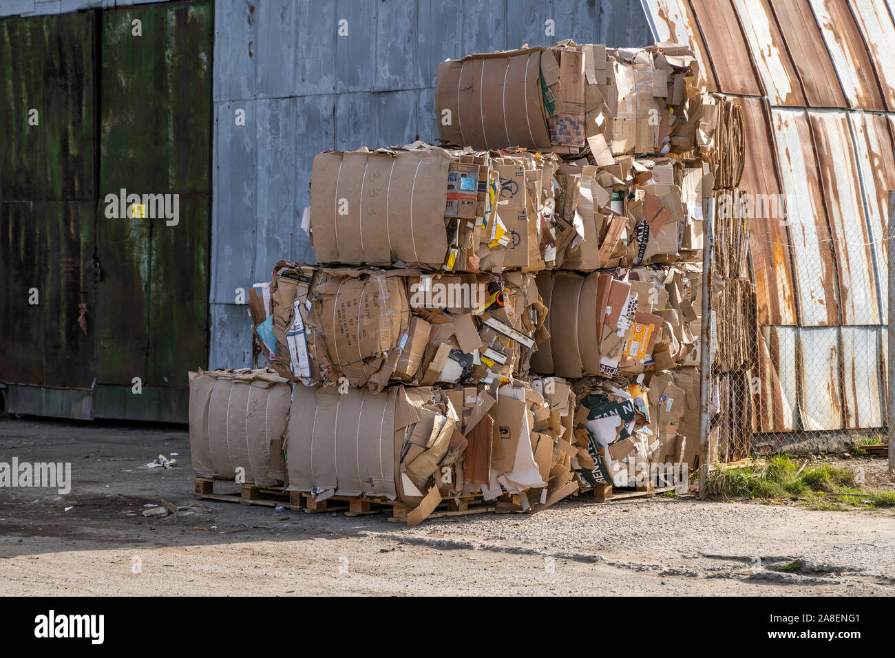 Bales of cardboard and box board with strapping wire ties. Background ...
