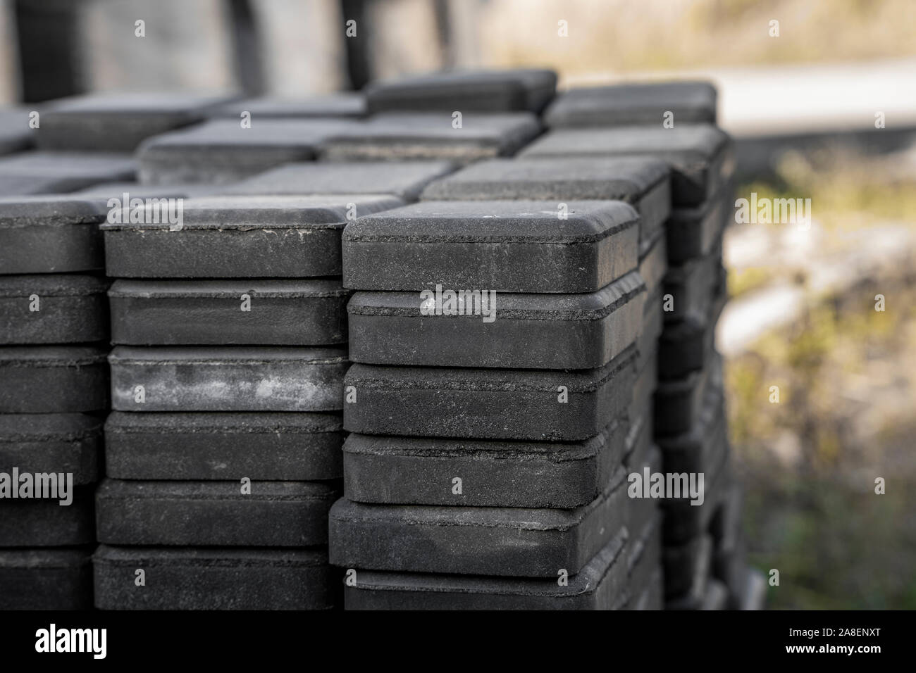 Stack of paving stone on construction site. Bricks for paving stones ...