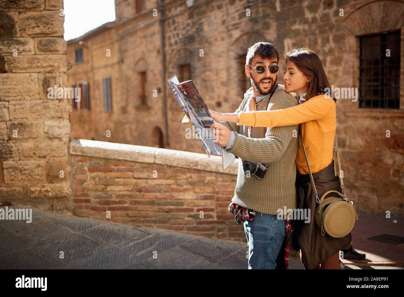 Young happy lovers couple visiting Italy as tourists Stock Photo - Alamy