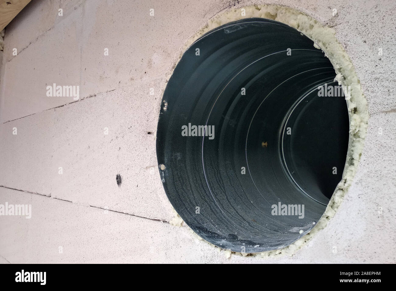 Metal ventilation pipe integrated in whine block wall under ...