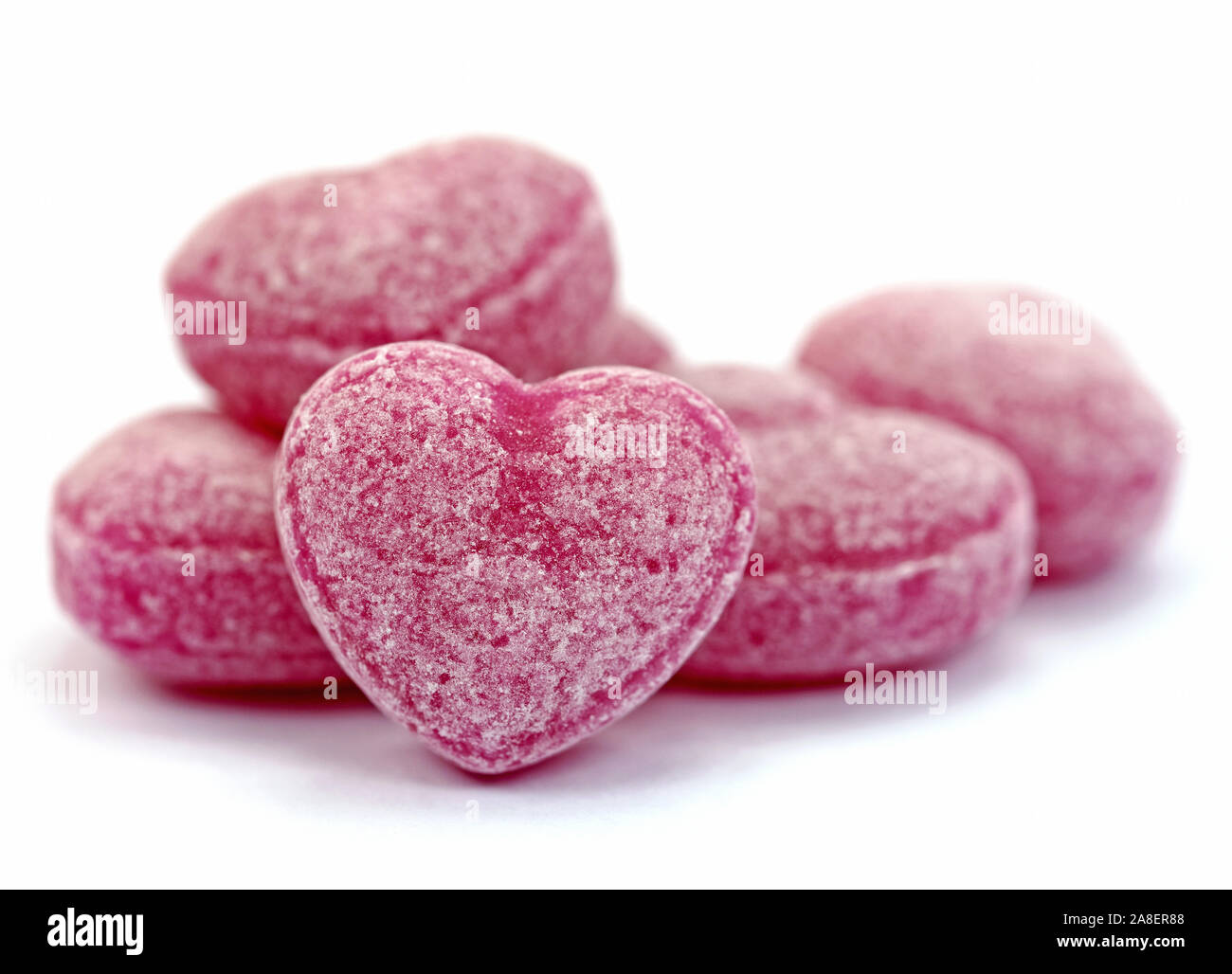 Heart shaped candies made from sugar in front of white background Stock ...