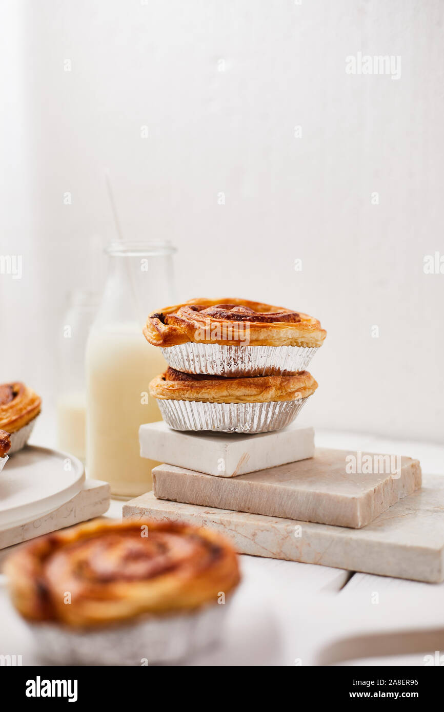 Fresh danish pastry with raisins on wood background.Tasty sweet bakery ...