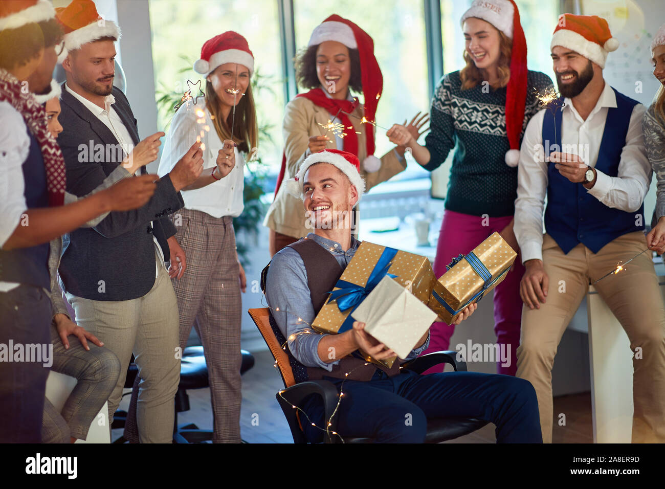 Office people celebrating winter holidays together at work.Happy ...