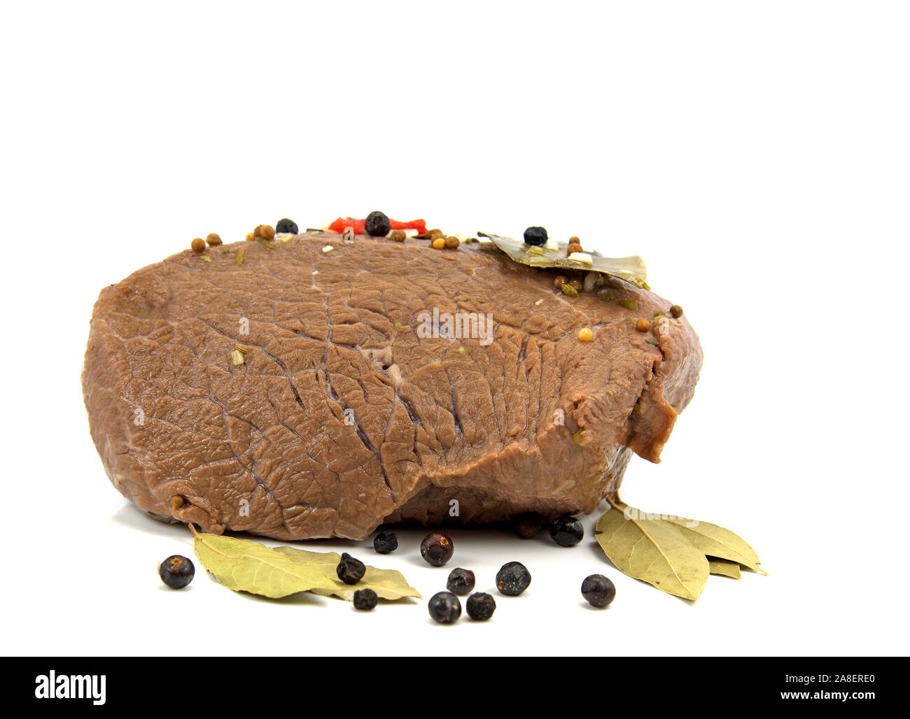 Beef roast marinated with spices against white background Stock Photo ...