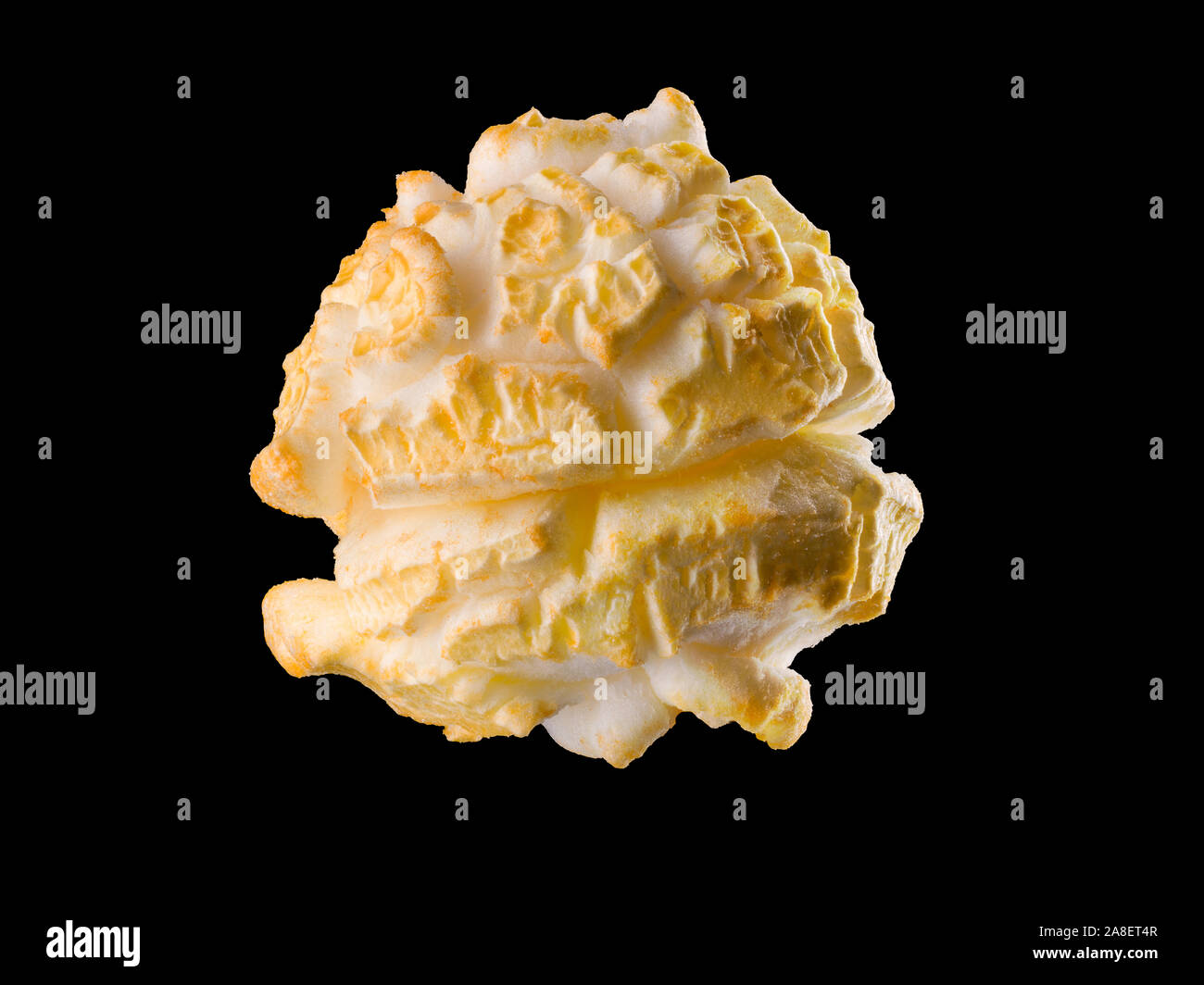Single popped popcorn on a black background with clipping path Stock ...